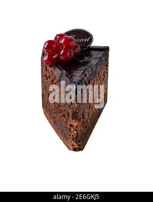 dark chocolate cake mozart , red currant on the table a cup of coffee ...