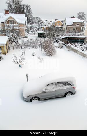 Snow covered car in Malmkoping, Sweden.Photo: Bo Arrhed Stock Photo - Alamy