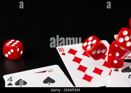 Dice and cards scattered on table close up Stock Photo - Alamy