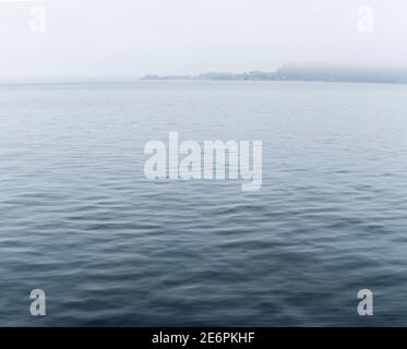 Fog over sea waves Stock Photo - Alamy