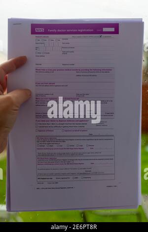 NHS family doctor services registration form Stock Photo - Alamy