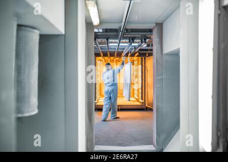 Baking metal products with powder paint Stock Photo - Alamy