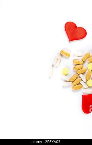 The hearts, tablets and pills isolated on white background Valentines ...