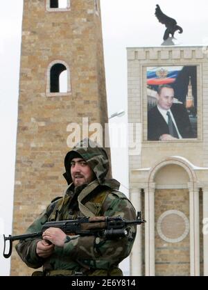 A Russian soldier in the Chechen capital of Grozny guards his comrades ...