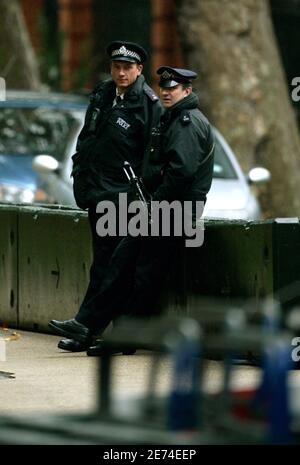 Armed police officer at main entrance gates to the Balmoral Estate ...