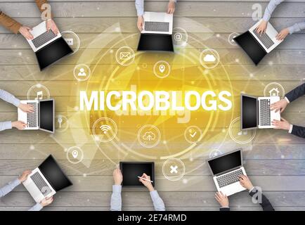 Group of people having a meeting with MICROBLOGS insciption, social ...