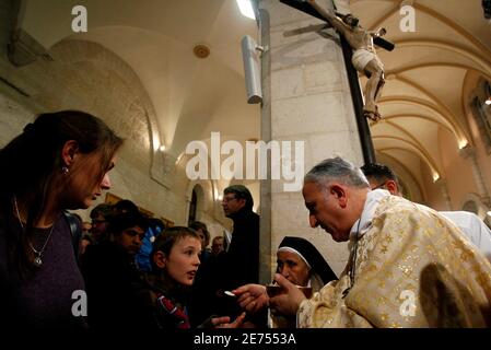 Catholic priest gives Holy Communion, Eucharist during a Catholic ...