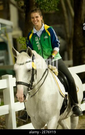 Brazilian dressage rider Luiza Tavares de Almeida performs with her ...