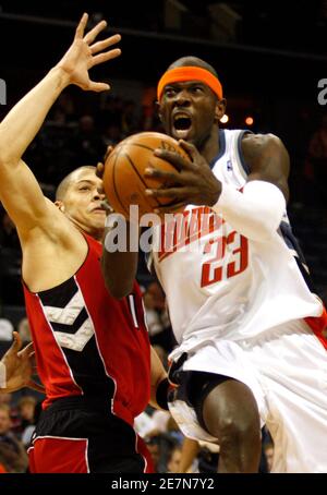 Charlotte Bobcat's Jason Richardson (23) drives to the basket as Utah ...