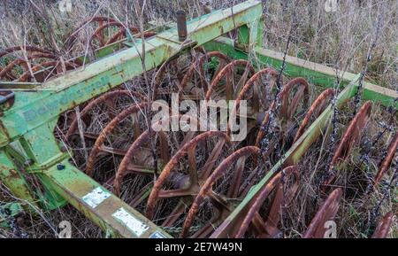 Abandoned Farmer's Furrow Press overgrown with grasses Stock Photo - Alamy