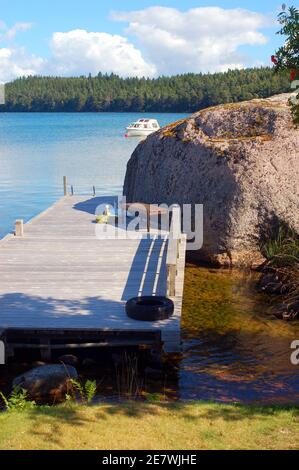 Stone pier and lake, Sweden Stock Photo - Alamy