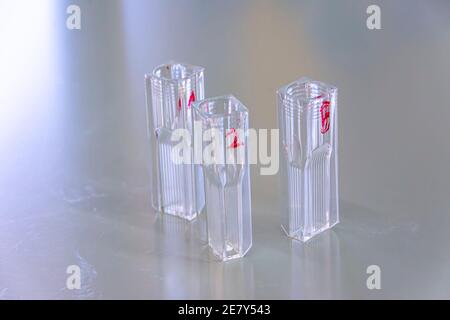 Quartz cuvette with the sample liquid for measurement Stock Photo - Alamy