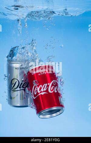 Freeze motion photo of a can of Coca Cola dropped into water Stock ...