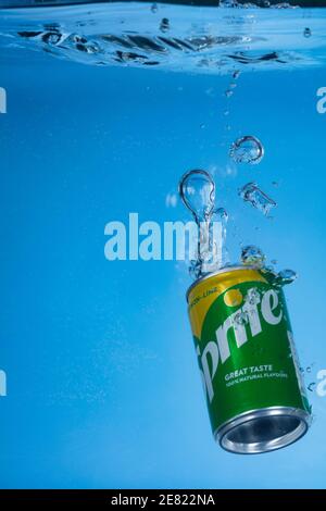 Freeze motion photo of a Sprite can dropped into water Stock Photo - Alamy