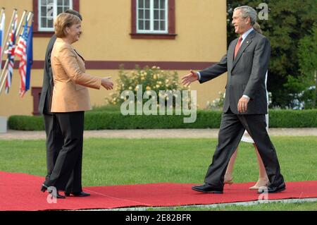 President George W. Bush greets German Chancellor Angela Merkel in the ...