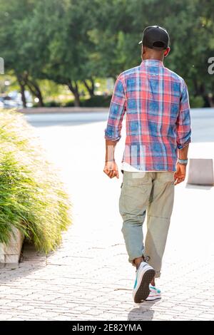Back of african black man walking at park outdoors Stock Photo - Alamy