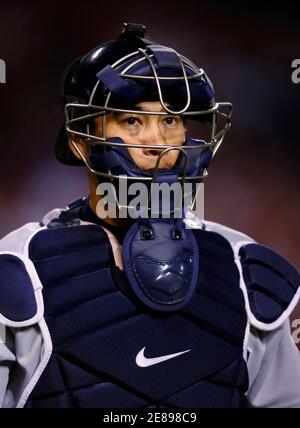 Seattle Mariners catcher Kenji Johjima throws to first after fielding a ...