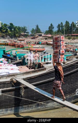 Bangladesh ship breaking yard (Chittagong). Ship recycling yard with industrial workers, heavy ...