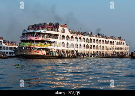 Overloaded passenger ferry with pilgrims on the Dhaka river, Port of ...