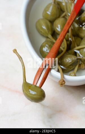 Pickled apples in bowl on white stone table. Close up. Traditional ...