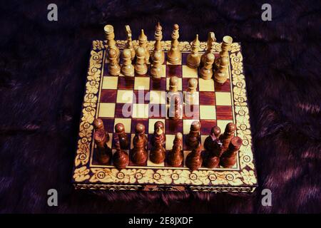Game pieces on furry chess board Stock Photo - Alamy
