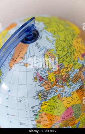 A vertical closeup shot of rotary world globe model Stock Photo - Alamy