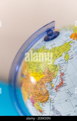 A vertical closeup shot of rotary world globe model Stock Photo - Alamy