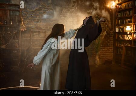 Exorcist casting out satan from crazy woman Stock Photo - Alamy