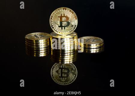 Golden bitcoin coin on podium on holographic, abstract, neon background ...