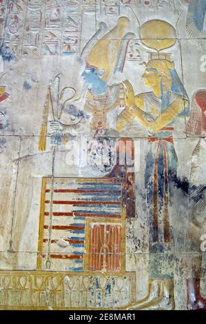 Wall carving showing the god Osiris offering the crook and flail to ...