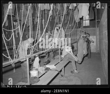 Miners changing clothes in wash and change house, Wyoming, 1946 Stock ...