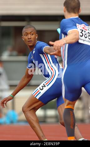 France's Bruno Naprix competes on men's 4x400 meters relay during the ...