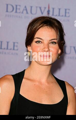 US-American actress Michelle Monaghan smiles in front of a placard ...