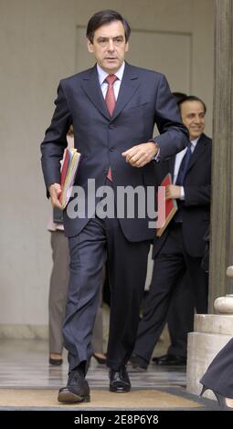 Prime minister Francois Fillon leaves the ministers council at the ...