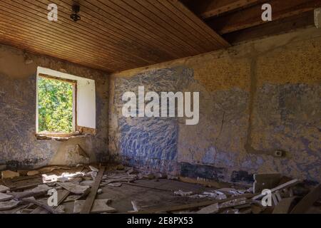 abandoned room inside destroyed house with old wallpaper and wooden ...