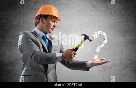 Businessman going to crash question mark Stock Photo - Alamy