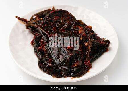 Sesame leaf kimchi on white background Stock Photo - Alamy