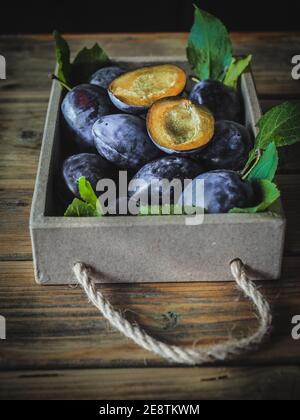 Fresh plums in wooden box Stock Photo - Alamy