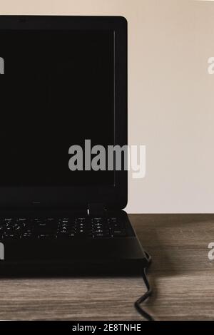 Half open laptop computer screen reflecting colorful lights on the ...