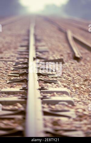 Road sign Railway crossing. Selective focus. In the background power ...