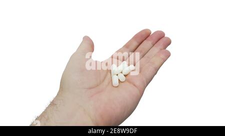 Hand holding rectal suppositories on white background Stock Photo - Alamy