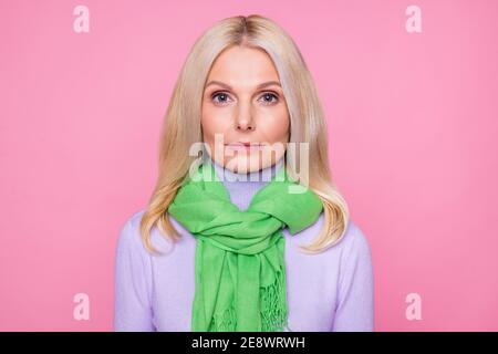 Photo of calm focused aged woman sit behind desk look concentrated ...