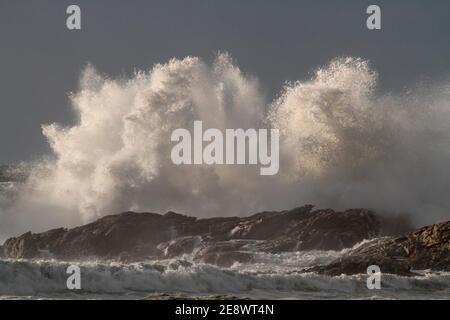 Storm on the coast seeig big wave breaking over rocks and cliffs seeing ...