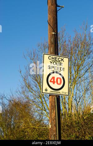 Police speed warning sign on the and speed markings on the road in New ...