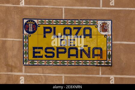Plaza de España, a street sign on a whitewashed wall in Benalmadena ...
