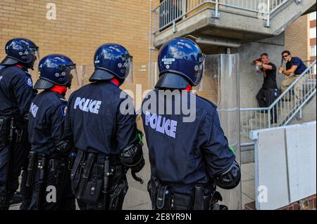 Police Tactical Response officers with a laser sighted automatic weapon ...