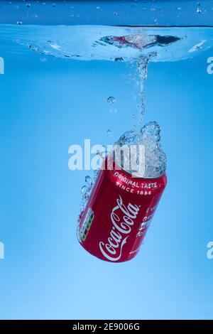 Freeze motion photo of a can of Coca Cola dropped into water Stock ...