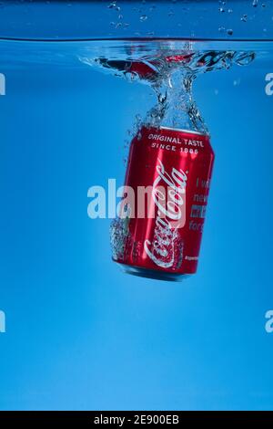 Freeze motion photo of a can of Coca Cola dropped into water Stock ...