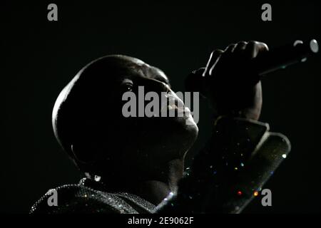 Seal performs while his wife Heidi Klum walks the runway during the ...