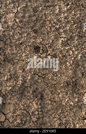 Close-up of cracked clay soil texture, natural earth layers background ...